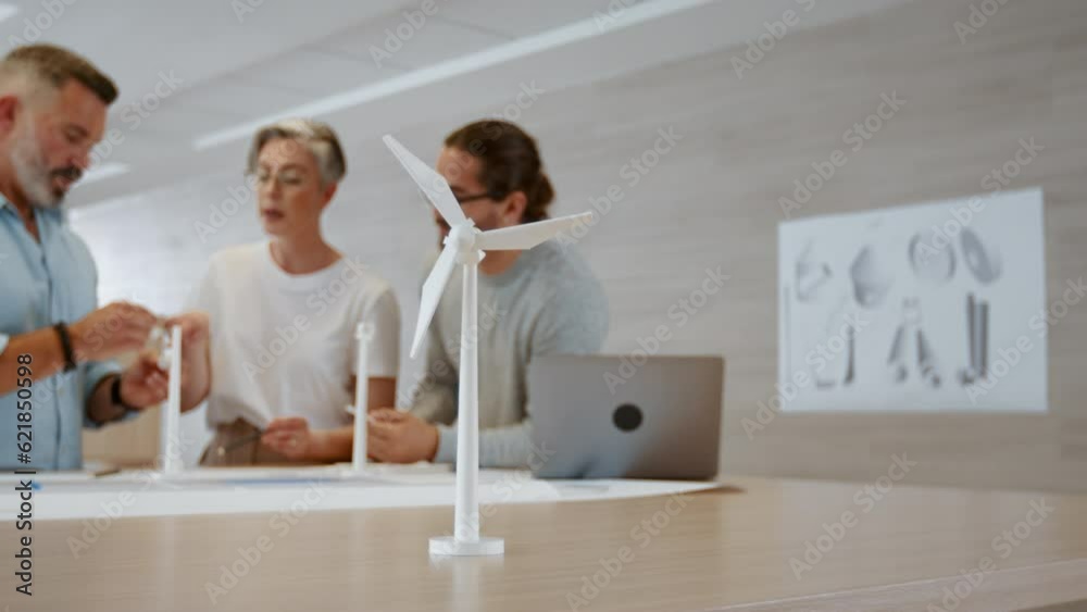 Engineers working together in a brainstorming meeting, discussing and ...