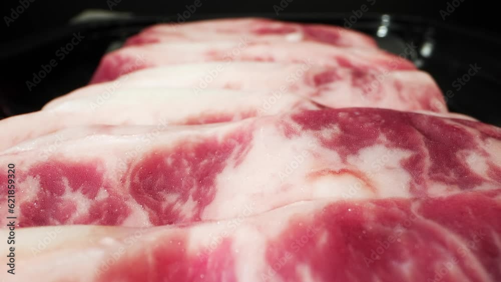 Captivating macro video showcases frozen dry-aged beef sealed in vacuum ...