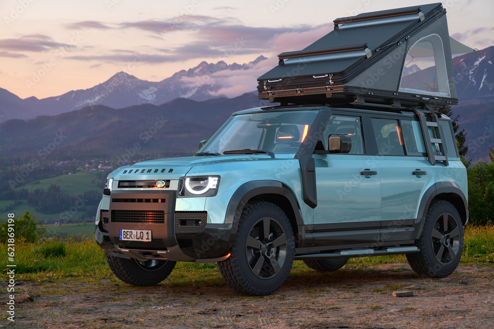 Land Rover Defender in wild terrain, equipped with expedition gear and ...