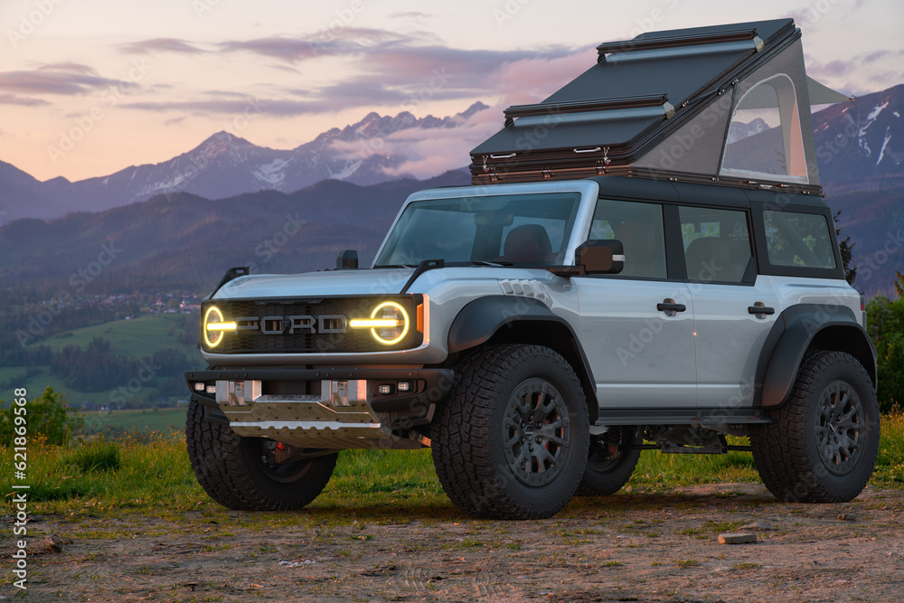 Ford Bronco Raptor in wild terrain, equipped with expedition gear and a ...
