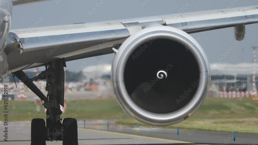 Hot air behind jet engine of plane at airport. Airplane is taxiing to ...