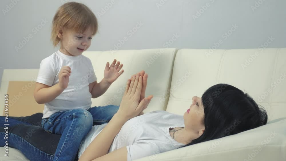 happy family concept. mom and daughter clap their hands. lifestyle ...
