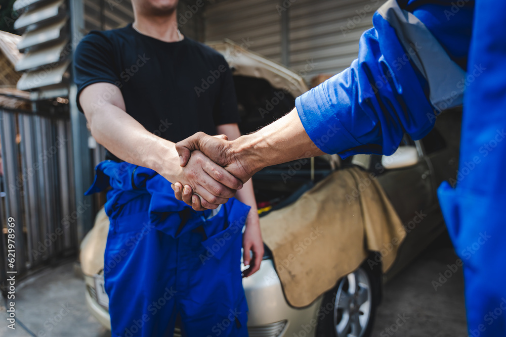 Auto mechanic handshake showing success collaboration of mechanics ...
