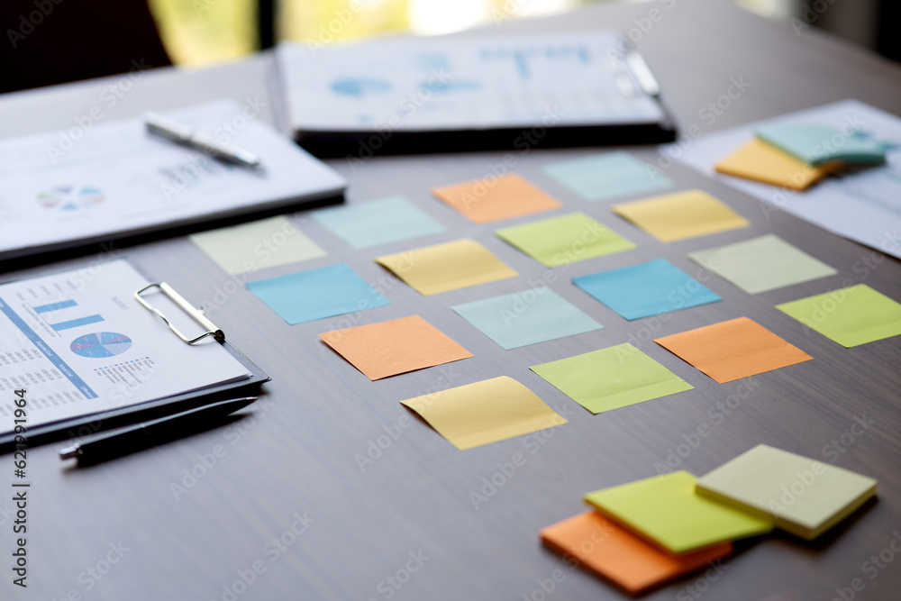 Document chart graph colored sticky notes It's on the table in the ...