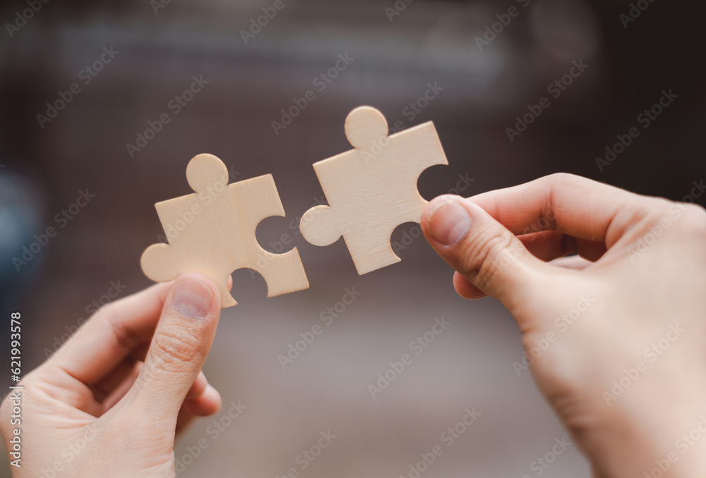 Business teamwork concept. Businessman holding a puzzle, business ...