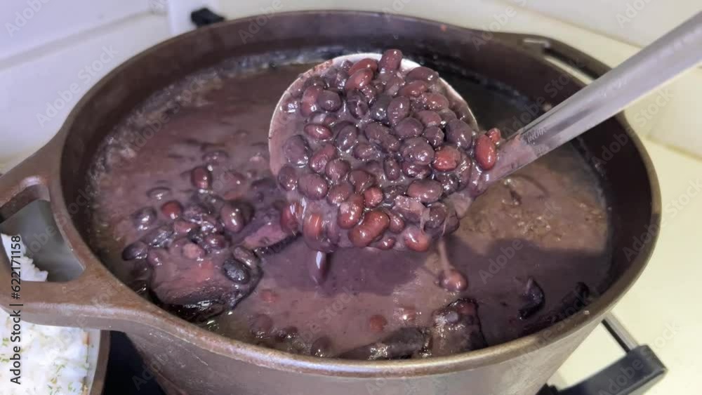 ugly, not appetizing food boiled beans in saucepan to pick up with a ...