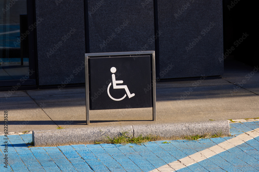 Handicap sign on black board. This is parking lot for reserve for ...