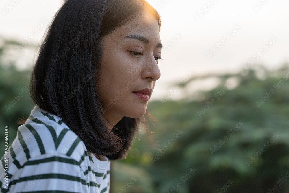 Depression and mental illness. Asian woman disappointed, sad after ...
