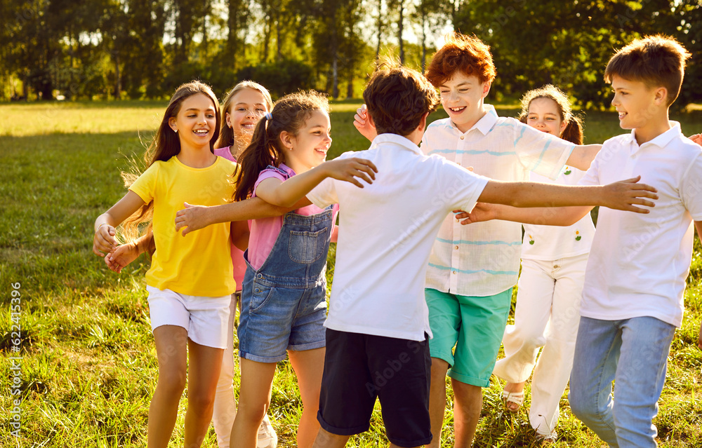 Kids meet in the park. Group of children playing together in the summer ...