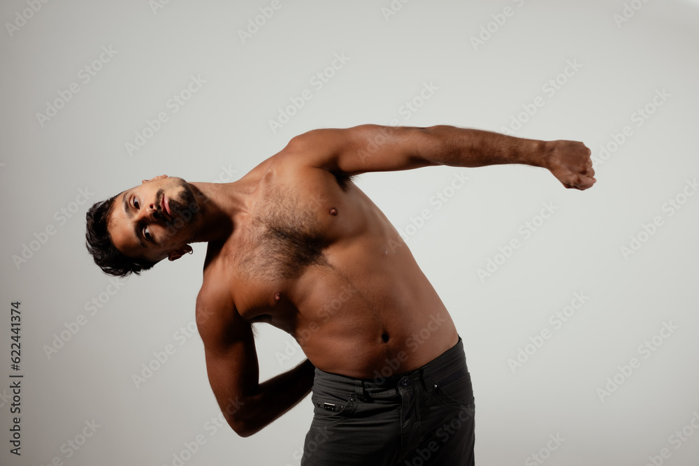 A man leans to the side, putting his head horizontal, with one ...