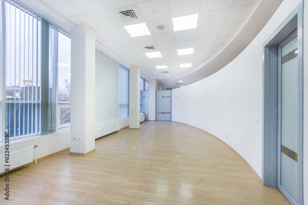An empty office space with a curved wall shape in a modern building ...