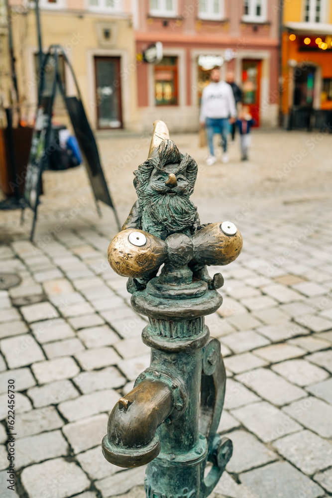 The Dwarfs of Wroclaw, Poland. Dwarfs sculptures lurking and hiding ...