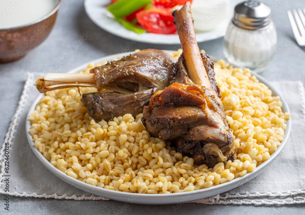 Turkish foods; lamb shank tandoori on bulgur wheat rice (Turkish name ...