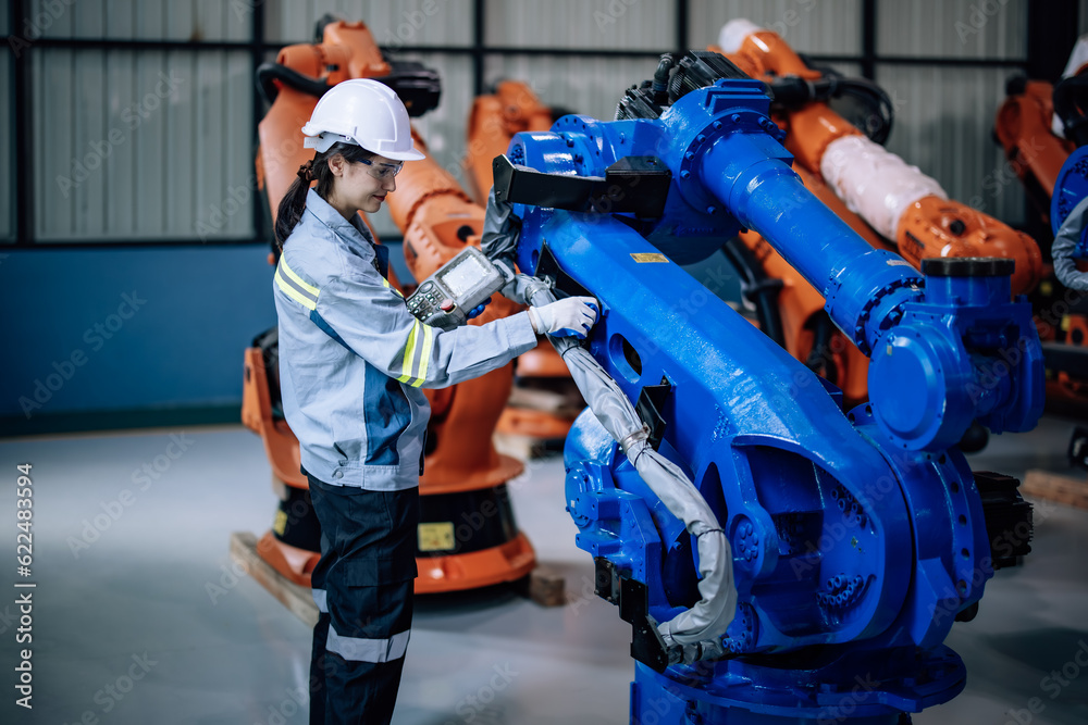 Robotic technician uses control panel to operate, maintain robotic arm ...