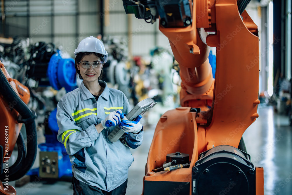 Robotic technician uses control panel to operate, maintain robotic arm ...