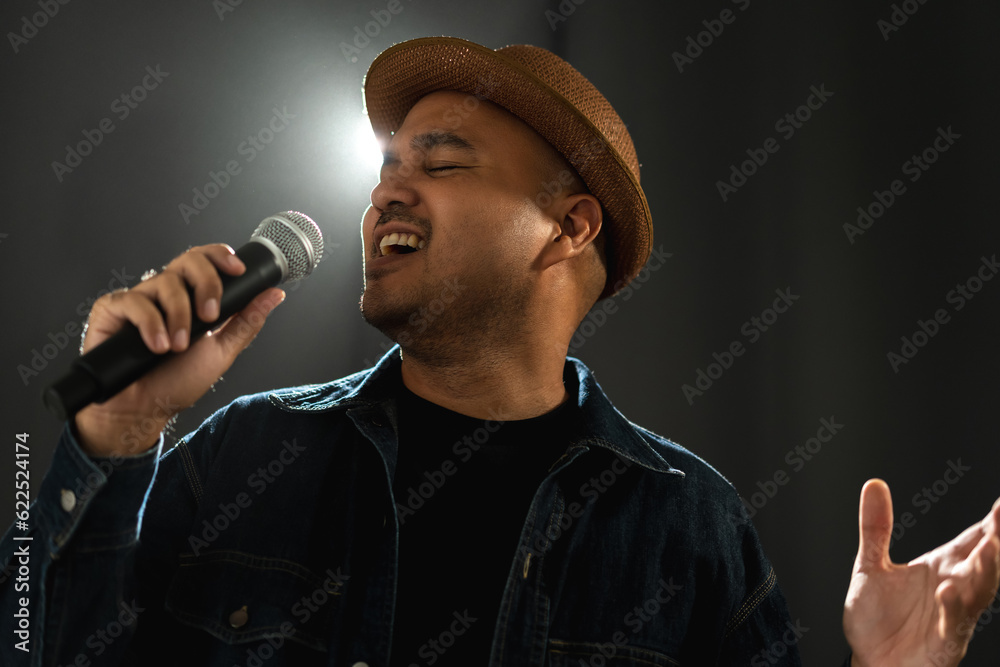 Close up shots of Attractive singer man singing music and playing ...