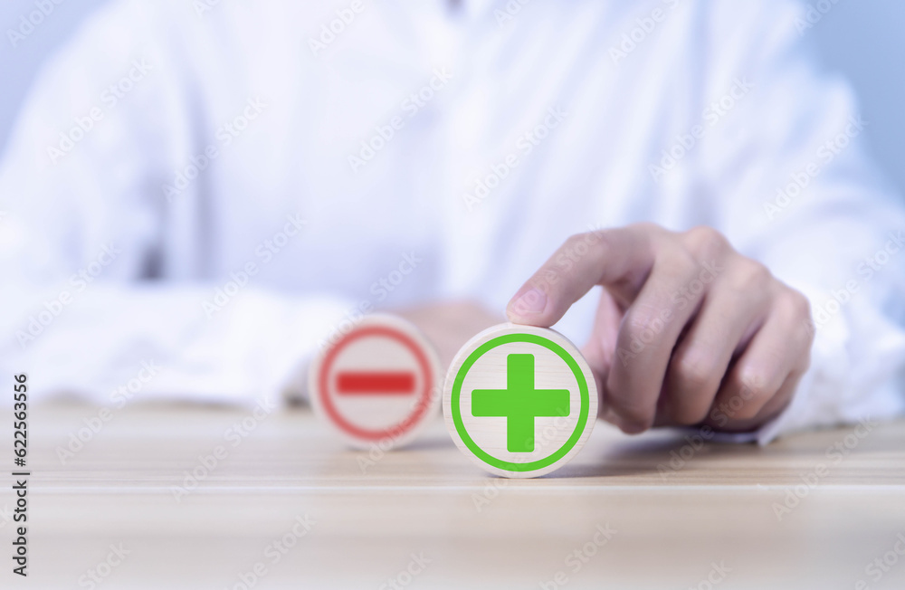 wood block shows plus and minus symbols. The concept of opposites ...