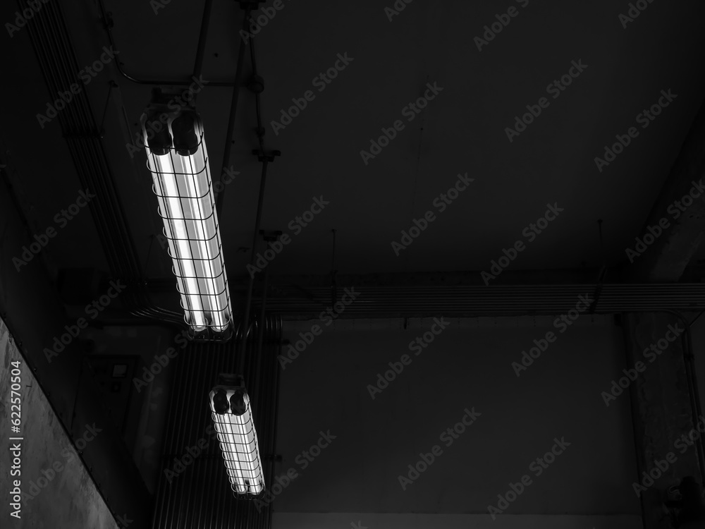 Loft industrial ceiling lights covered with wire mesh hanging under ...