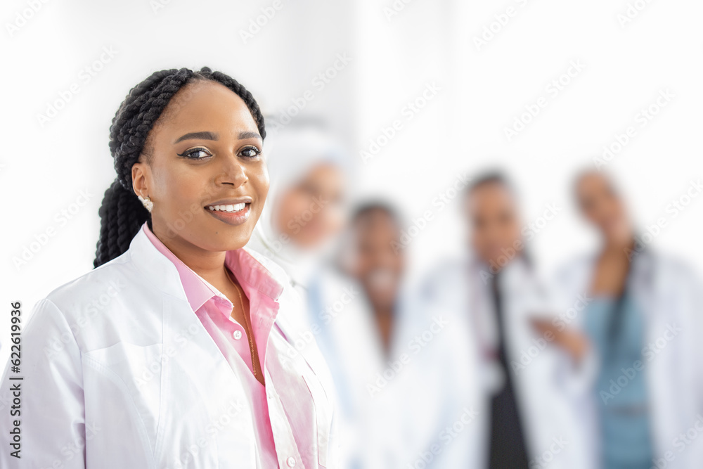 Doctor with dreadlocks of african-american ethnicity smiles with white ...