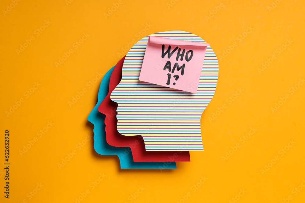 Colorful paper heads and note with text on yellow background Stock ...