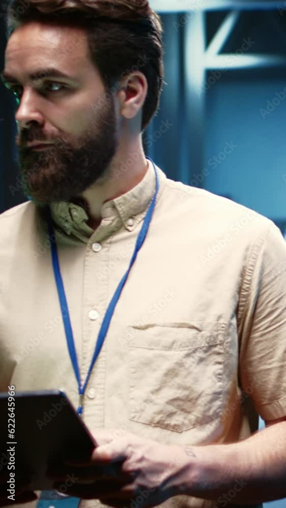 Vertical video Expert preparing server room recovery plan monitoring ...