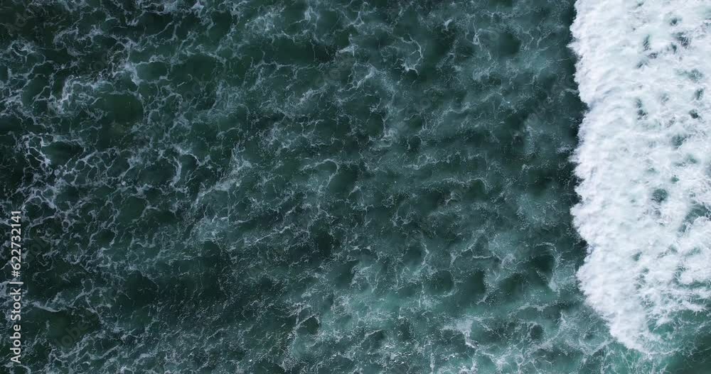 Broad wave broke and turned into bubbling white stream, sliding in a ...