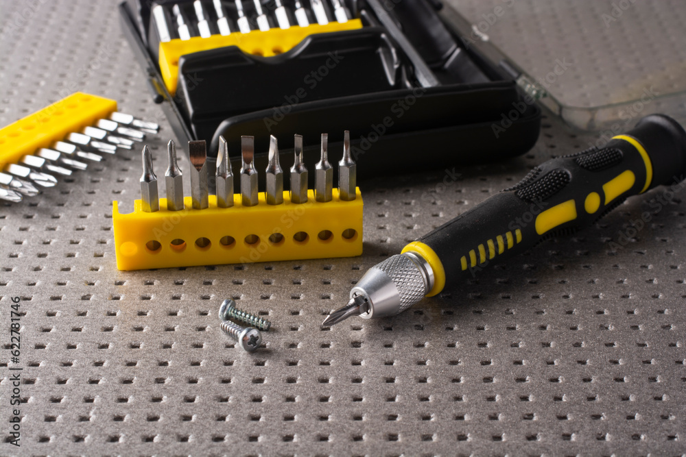 Interchangeable screwdriver set with different types of metal steel ...