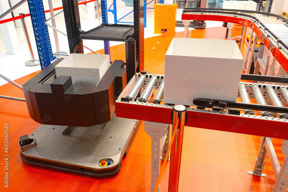 Robotic warehouse. Conveyor and robot with boxes. Robotic storage ...