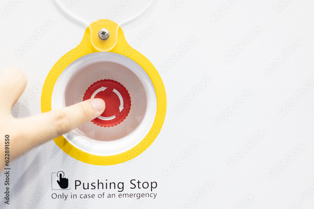 Stop Button and the Hand of Worker About to Press it. emergency stop ...