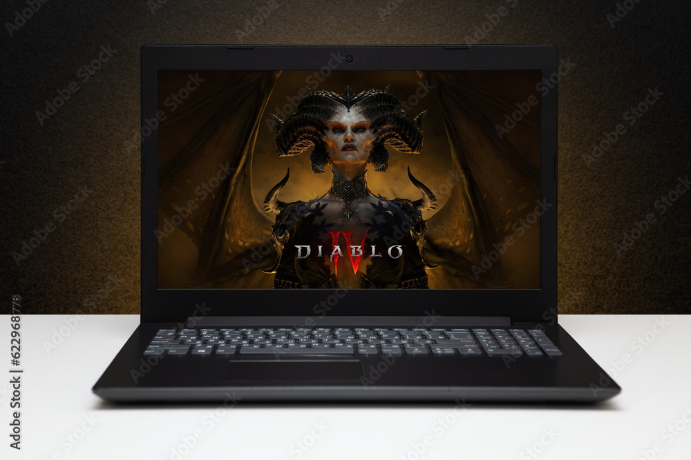 Foto de Diablo 4 game on the screen laptop computer on black textured ...