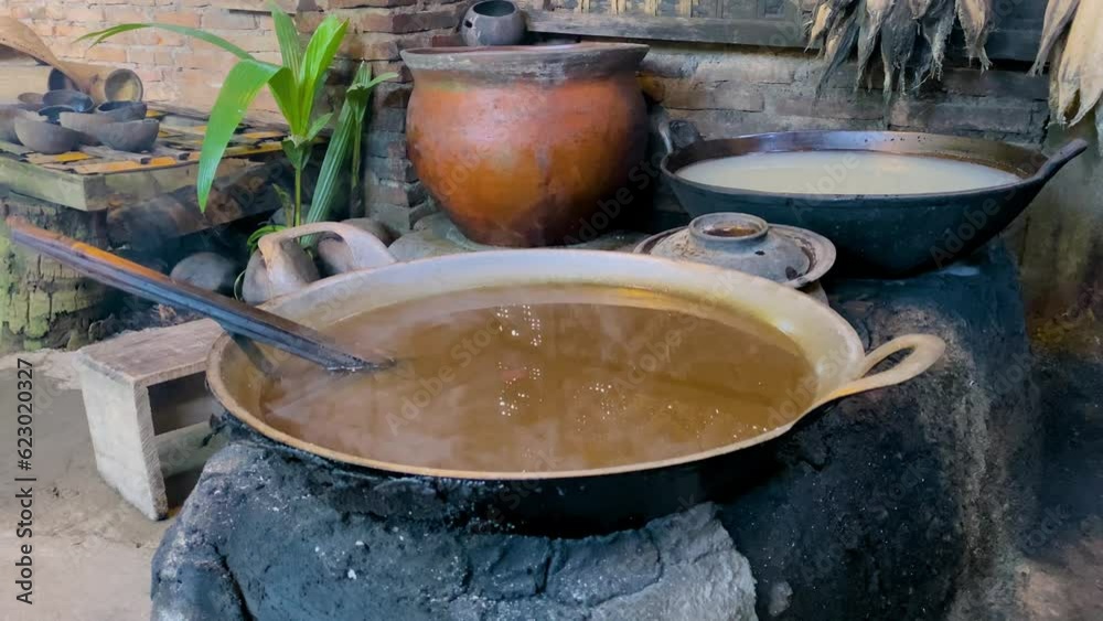 The process of making brown sugar or gula jawa. Liquid from coconut sap ...