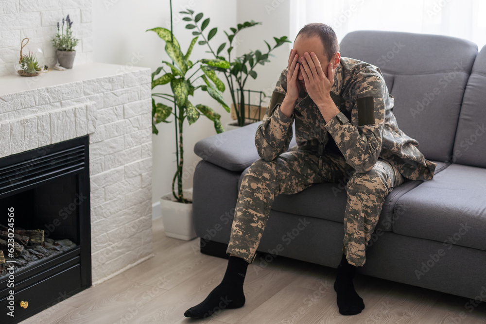 Serious anxious and nervous military man suffers from depression while ...
