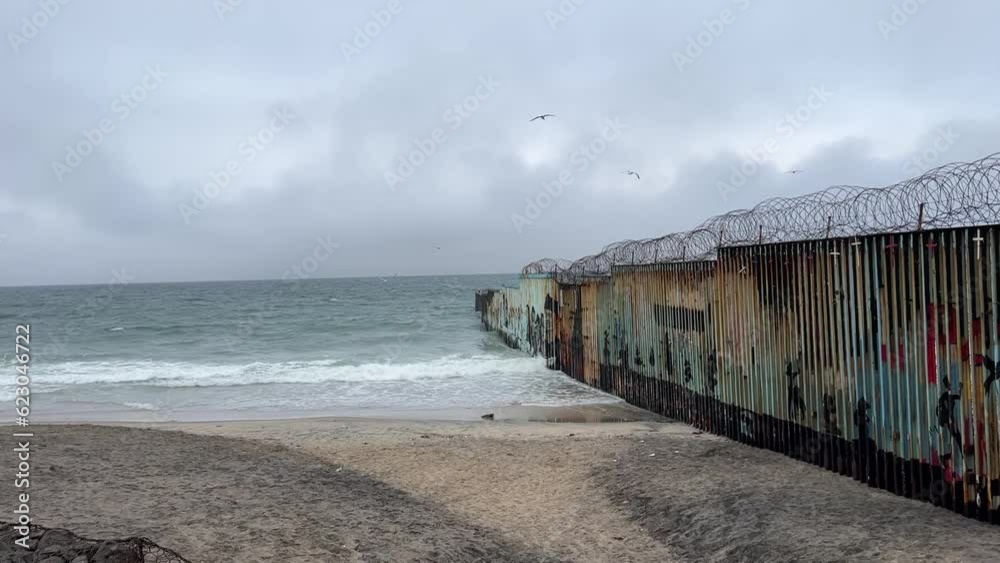 Border wall that separates the United States and Mexico. Filmed in ...