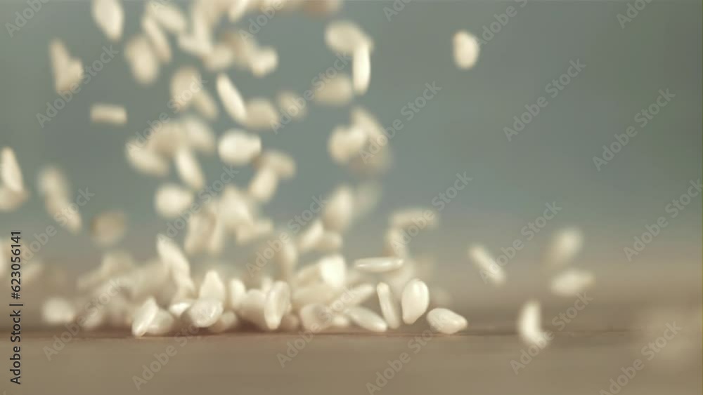 Falling sesame seeds on the table. Filmed is slow motion 1000 fps. High ...