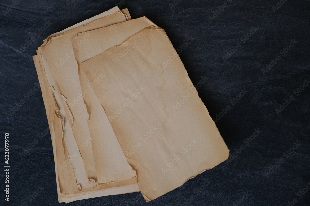 stack of sheets old retro paper without writing on black background ...