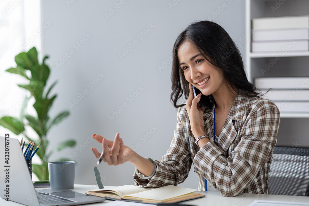 Beautiful asian woman talking on the phone, businesswoman working in ...