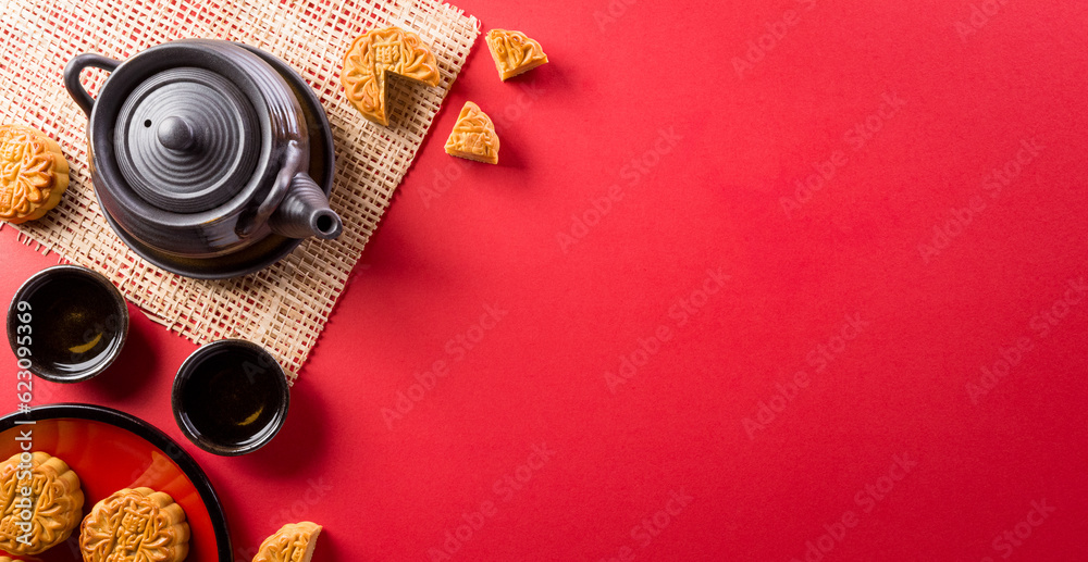 Chinese Mid-Autumn Festival concept made from mooncakes, tea and plum ...