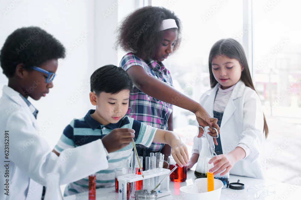 Group of students in science lab, studying science, doing a chemical ...
