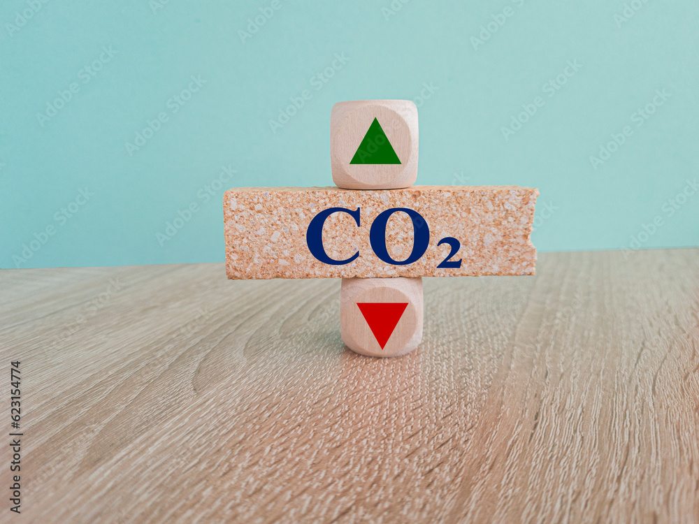 Blue text CO2 on brick block, cubes with arrow up down, concept of ...