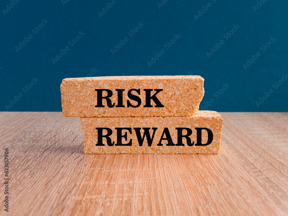 Risk Reward and support symbol. Concept words Risk Reward on brick ...