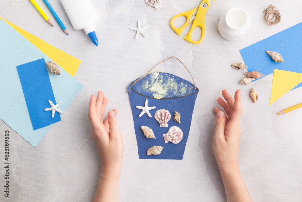 Paper bucket of shells summer idea for kids craft in kindergarten hands ...