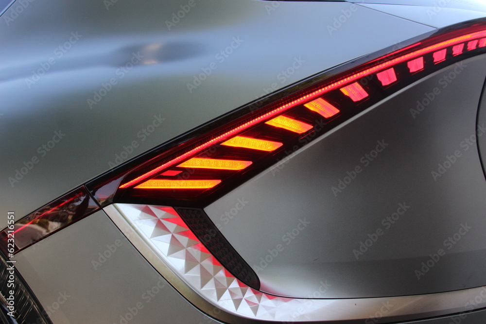Sleek newly washed electric car rear view. Electric car wallpaper ...
