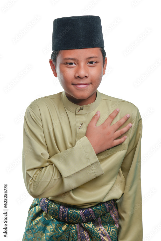 A malay boy wearing a traditional malay costume called baju melayu ...