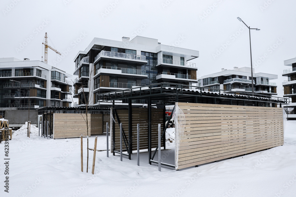 bike boxes for storing bicycles and scooters in the courtyard of a ...