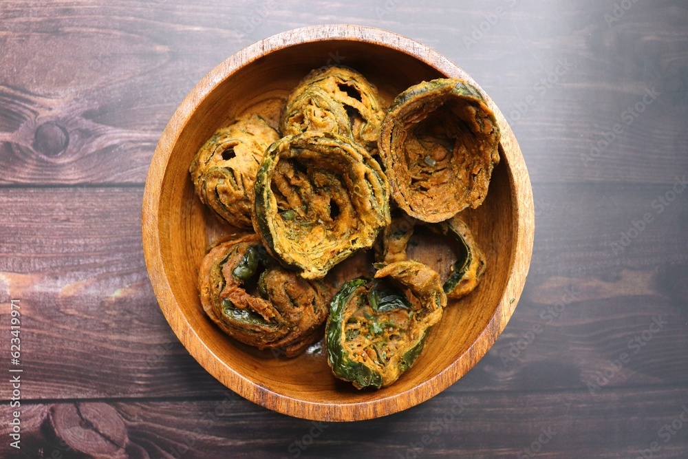 Dry Patra is an Indian dish made with colocasia leaves that are coated ...