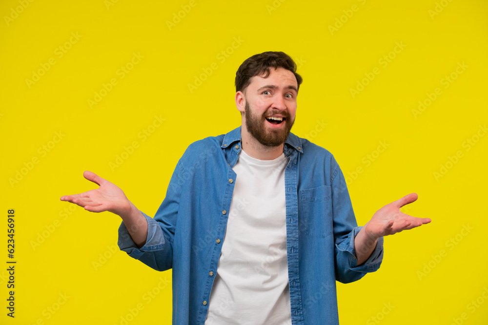 Young man posing with clueless face expression and open hands Stock ...