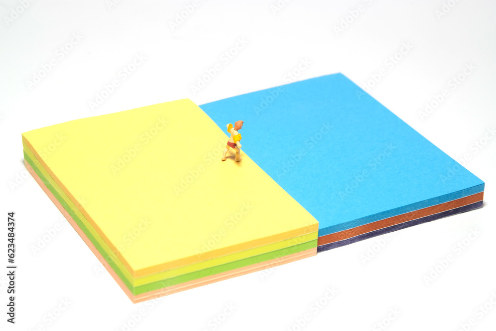 Creative miniature people toy figure photography. Sticky notes ...