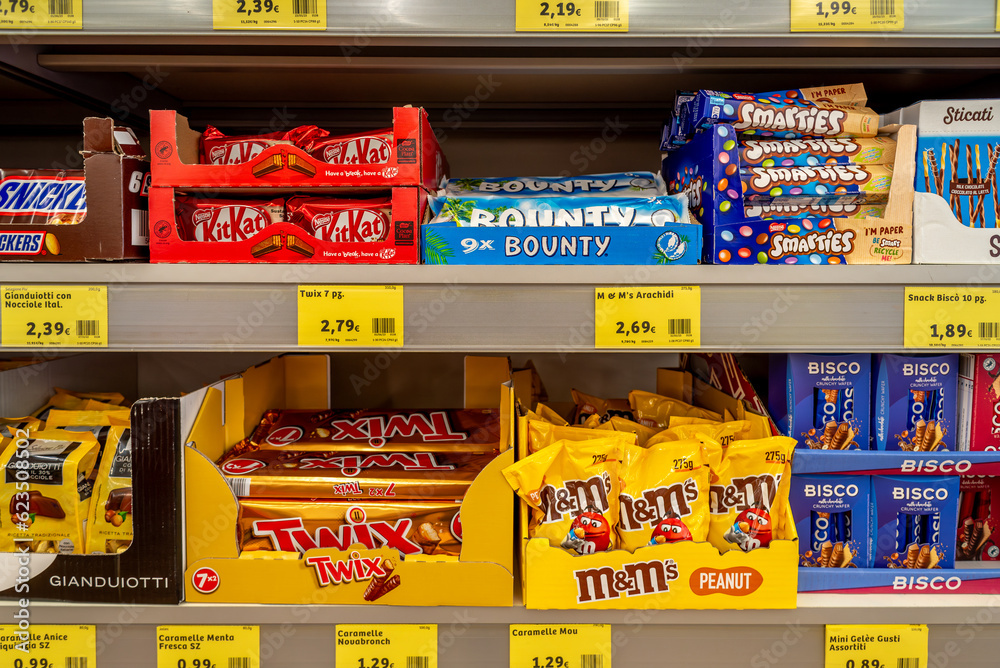 Italy - 13 July 2023: packages of KitKat and Bounty candy, Smarties and ...