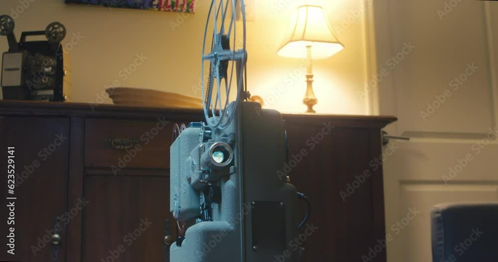 Old Film Projector. An Old Movie Projector Scrolls 8 mm Film with ...