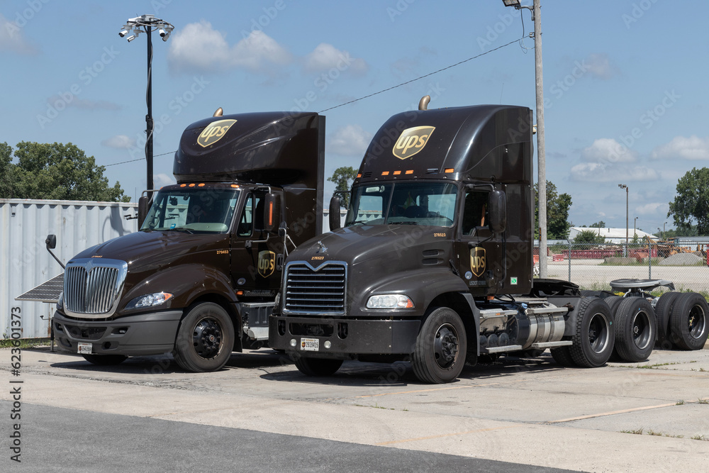 UPS delivery and transport trucks. UPS picks up, transports and ...